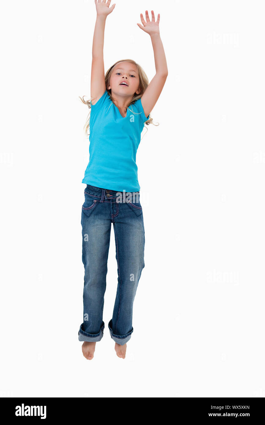 Portrait of a girl jumping against a white background Stock Photo - Alamy