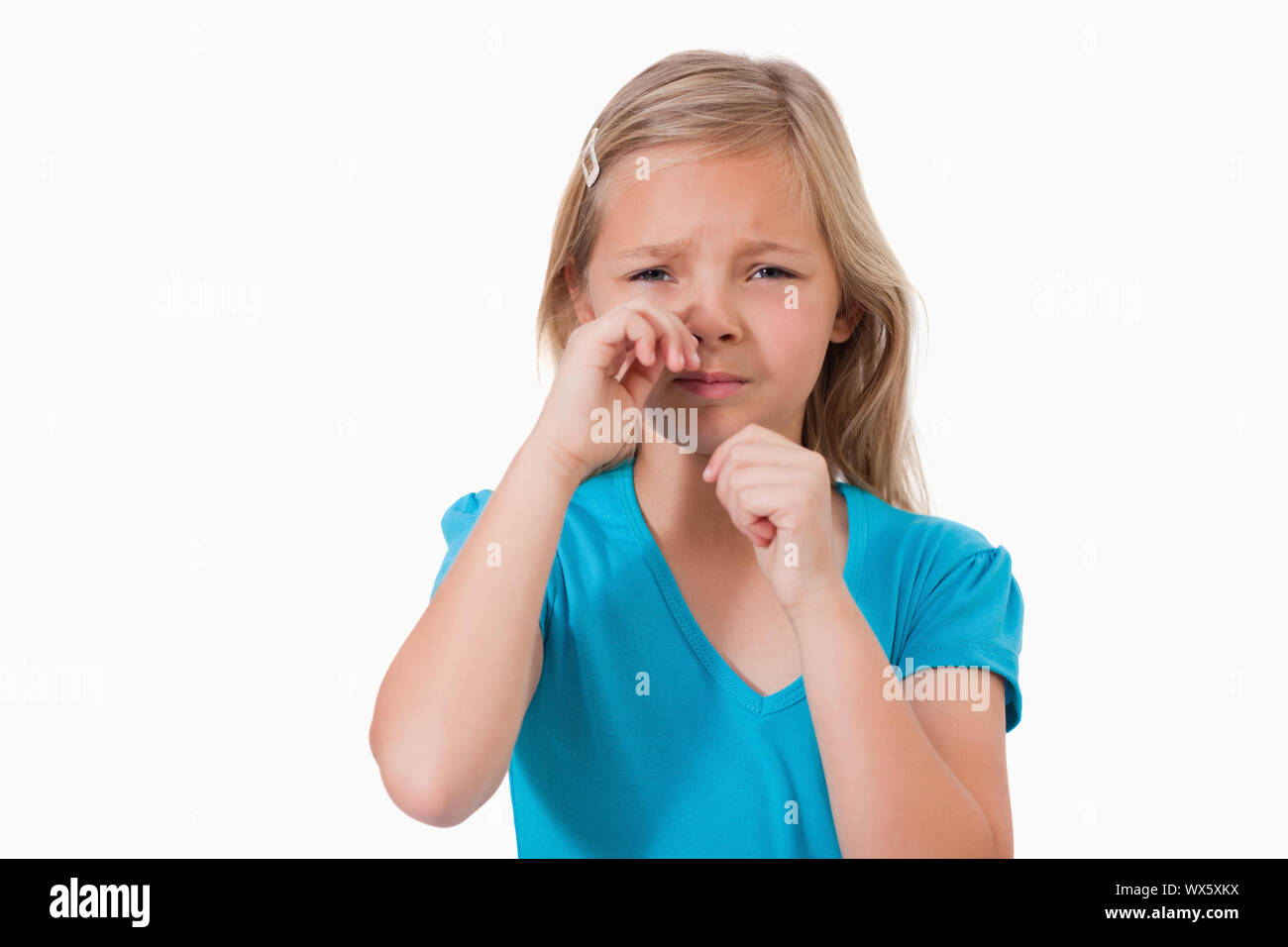 Lonely little girl crying against a white background Stock Photo - Alamy