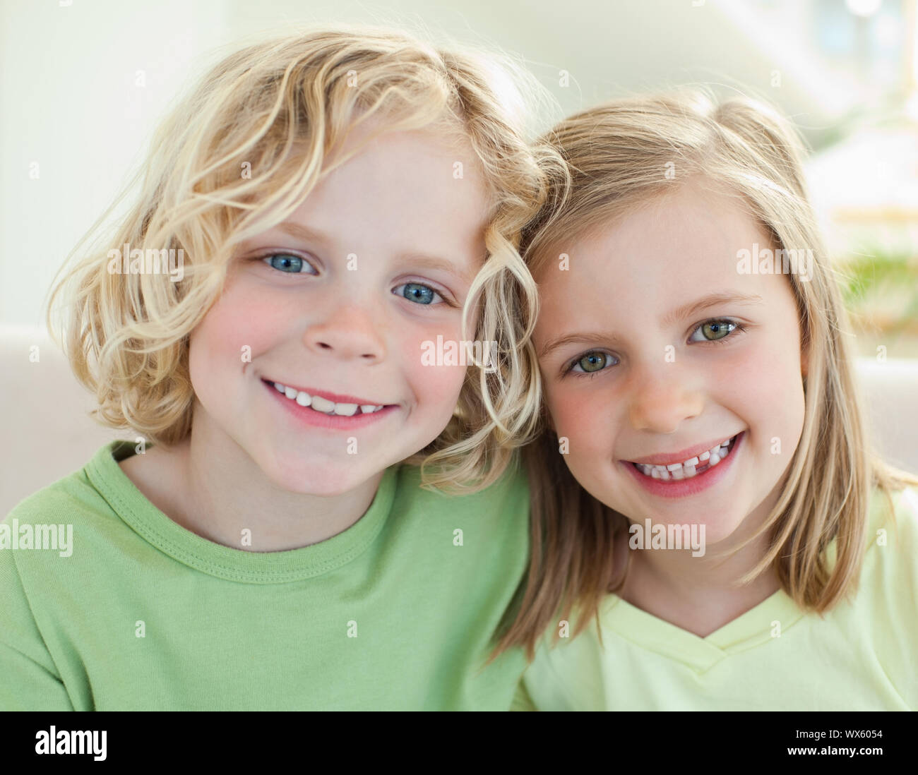 Happy smiling siblings Stock Photo - Alamy