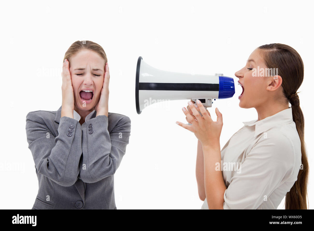 Manager yelling at her colleague through a megaphone against a white ...