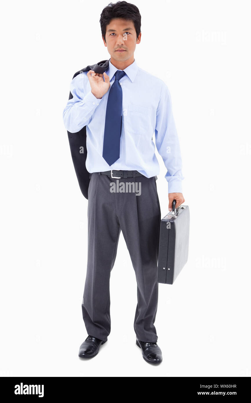 Portrait of a businessman holding a briefcase and his jacket over his ...