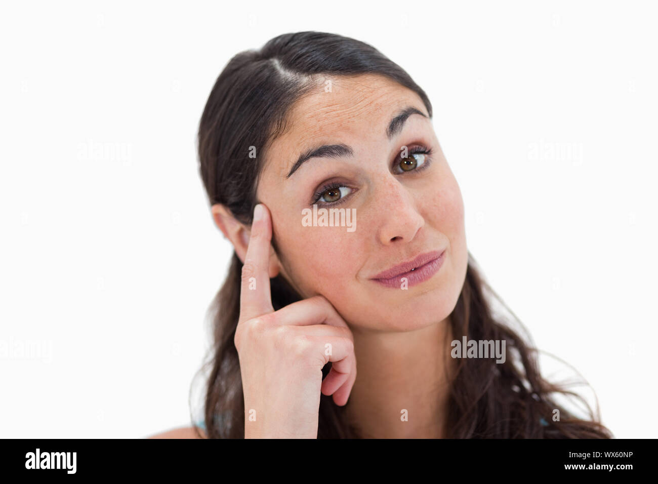 Woman looking at the camera against a white background Stock Photo - Alamy