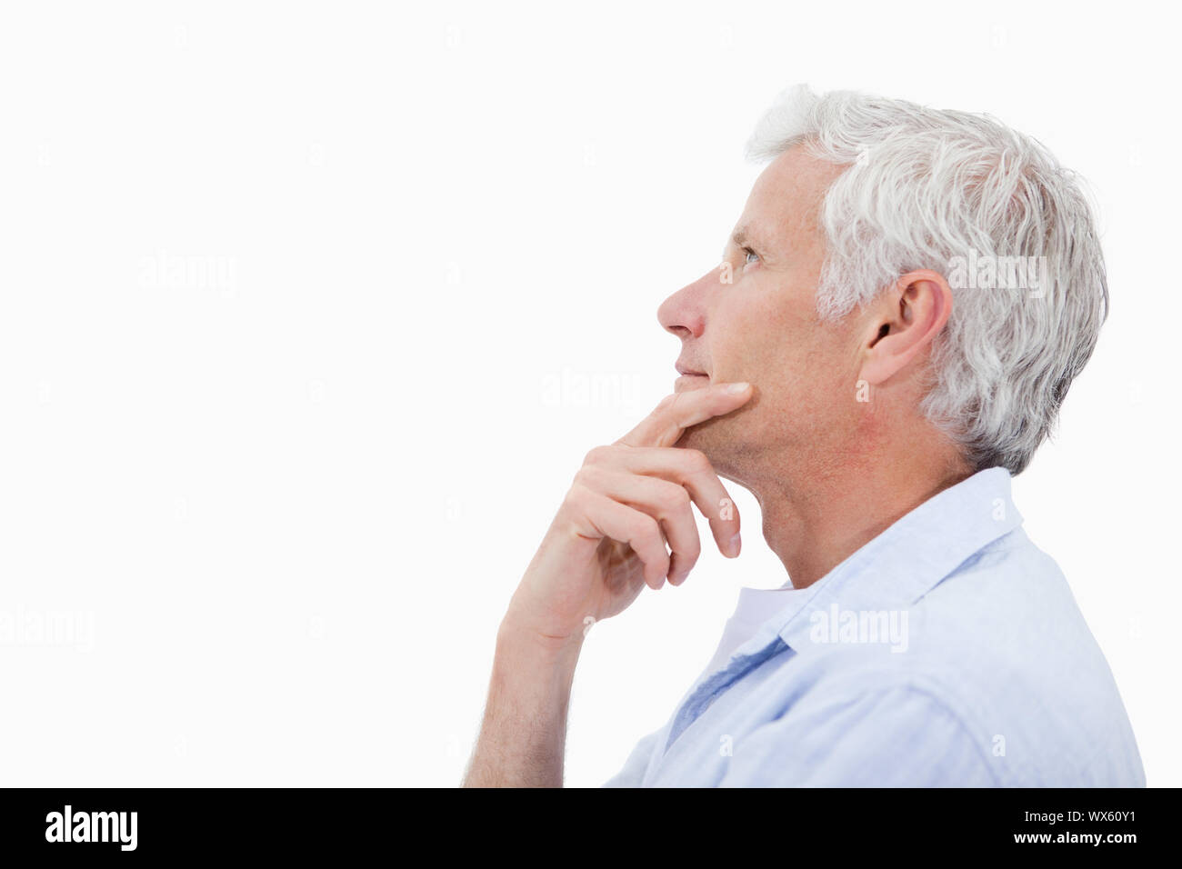 Side view of a man thinking against a white background Stock Photo - Alamy