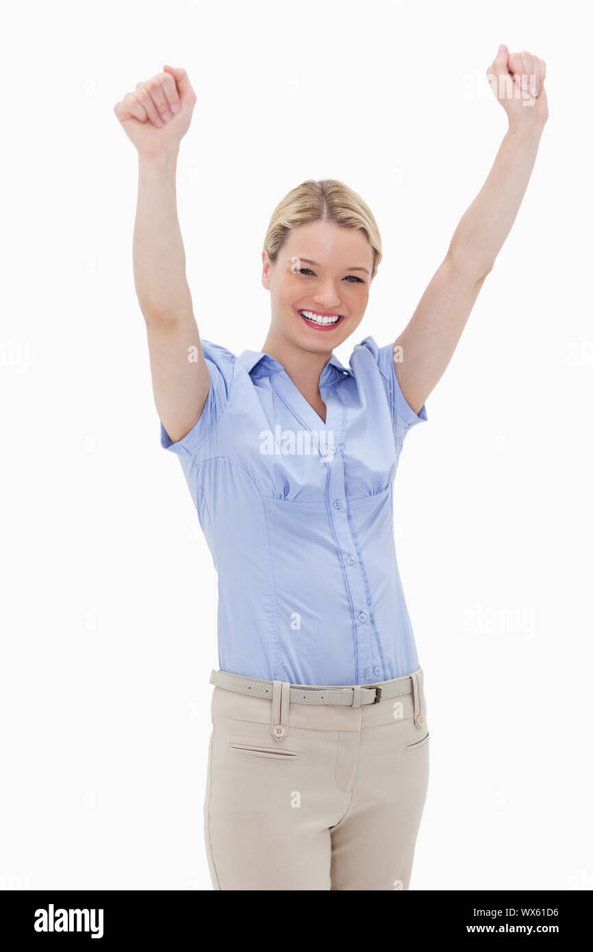 Happy cheering woman against a white background Stock Photo - Alamy