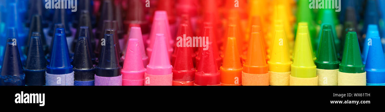 Box of crayons in a rainbow of colors background Stock Photo - Alamy