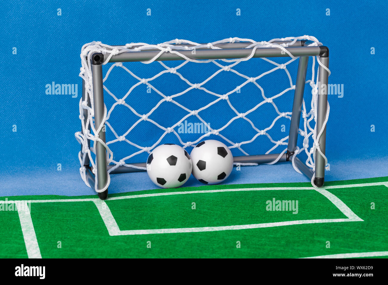 Toy football field and gate Stock Photo - Alamy