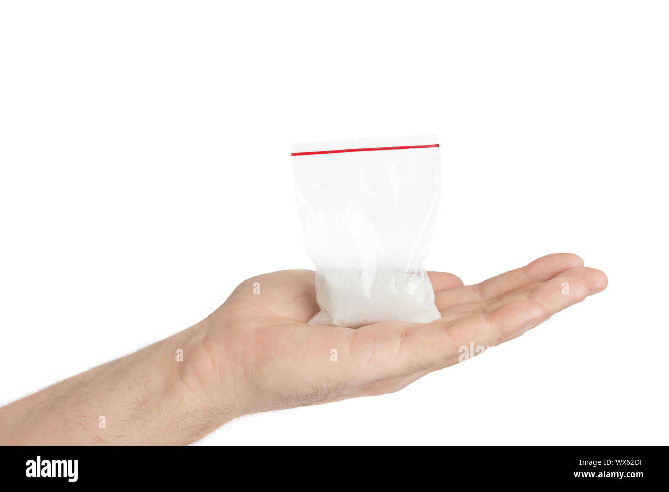 Hand and packet with narcotic Stock Photo - Alamy