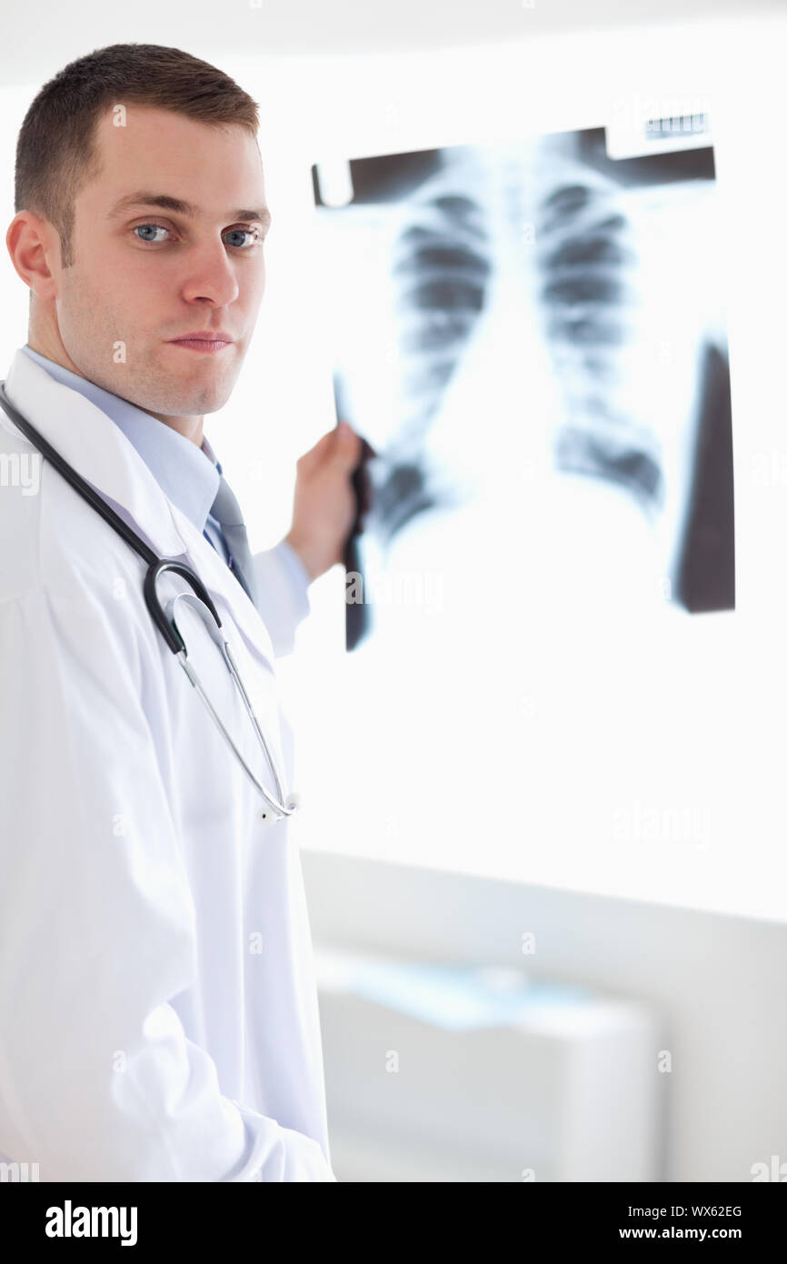 Doctor showing x-ray image to patient Stock Photo - Alamy
