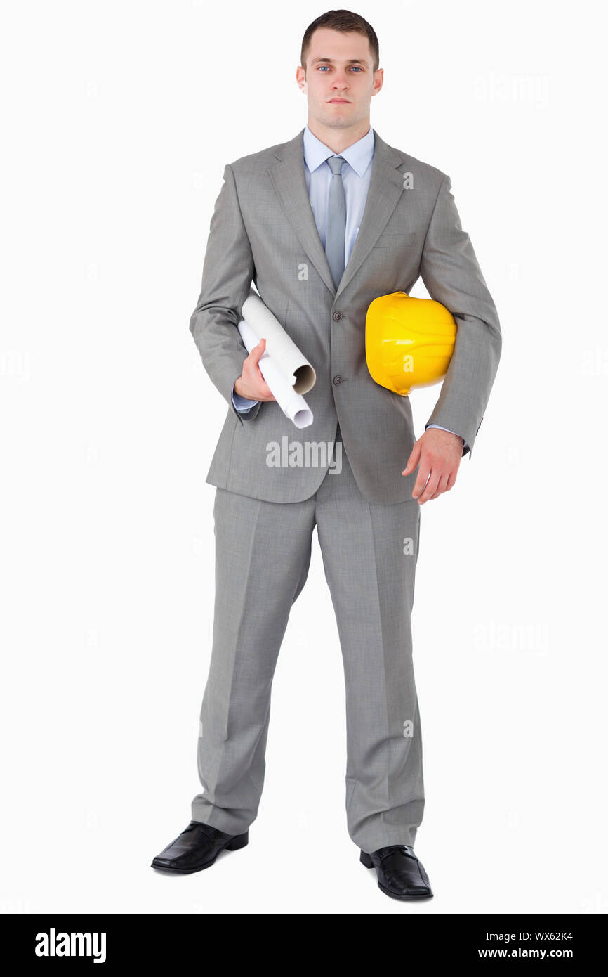 Architect with helmet and plans on white background Stock Photo - Alamy