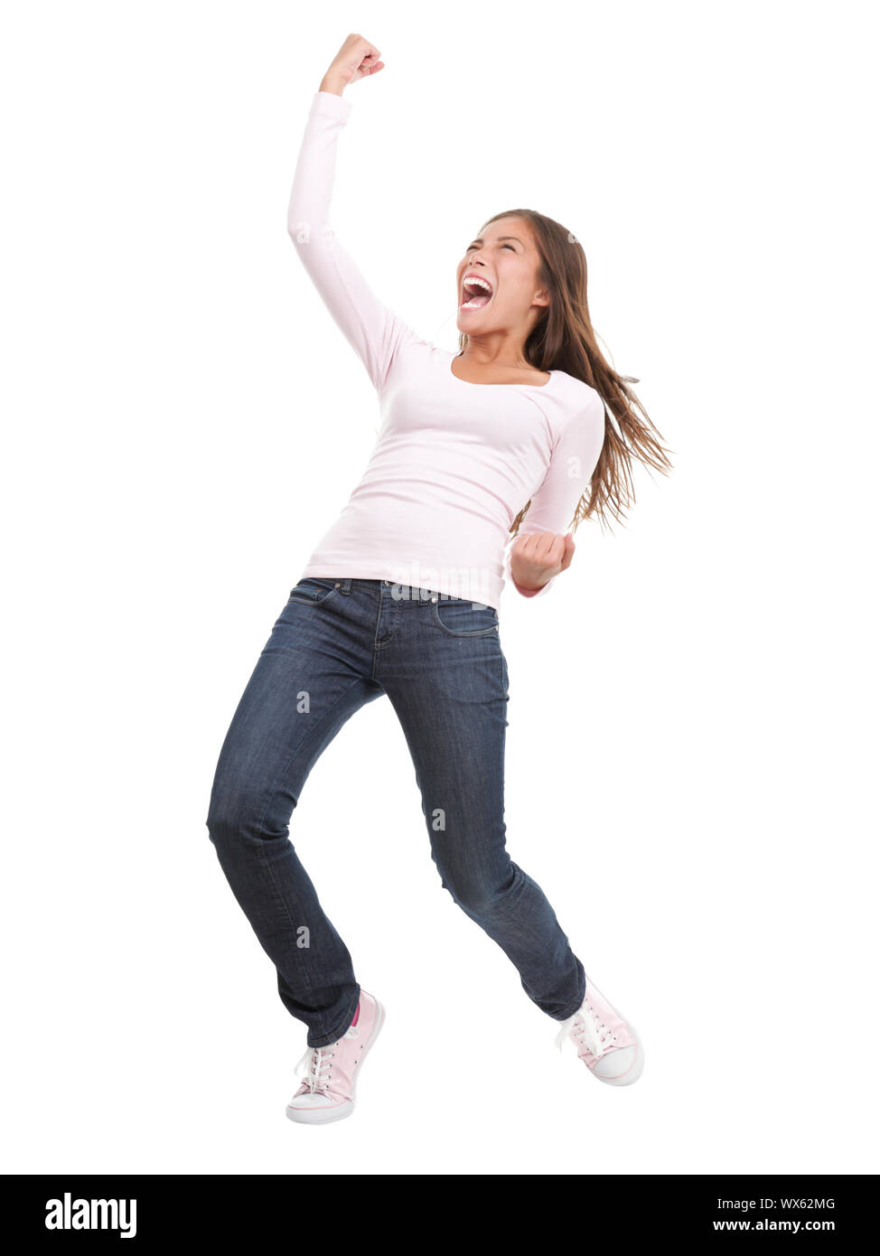 Winning success woman in full length cheering and screaming of joy ...