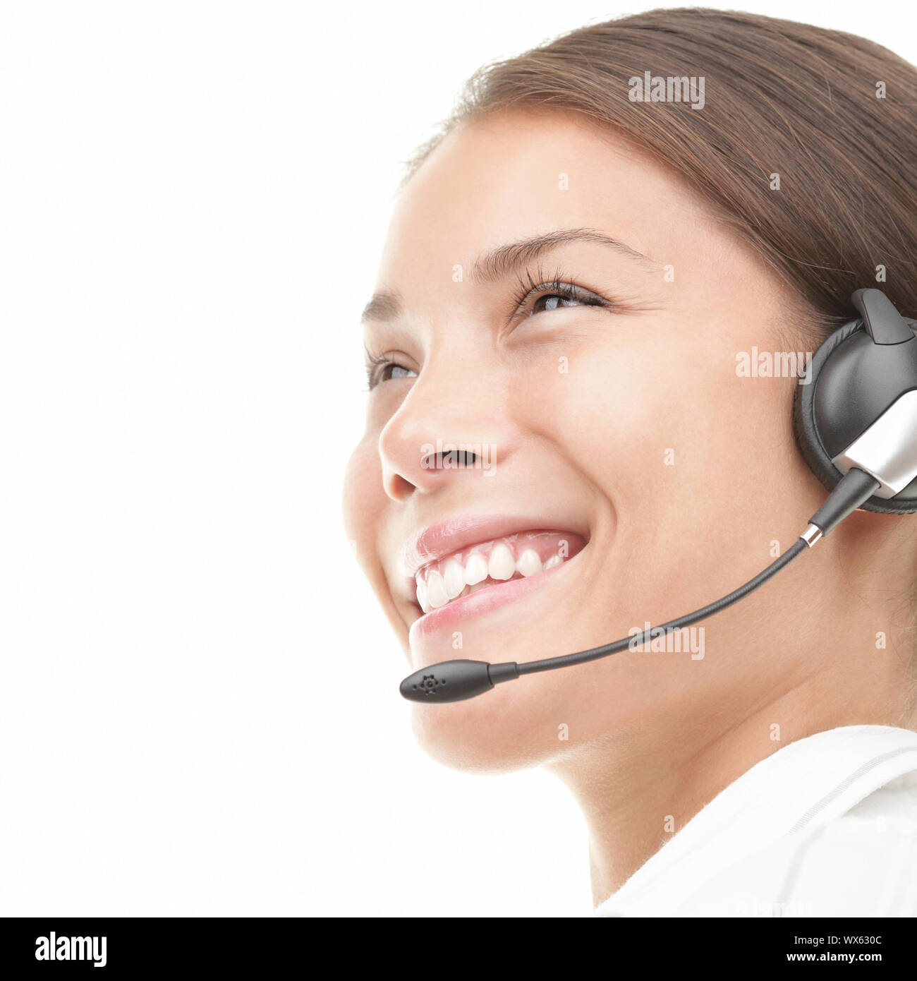 Headset woman in profile - closeup on white background Stock Photo - Alamy