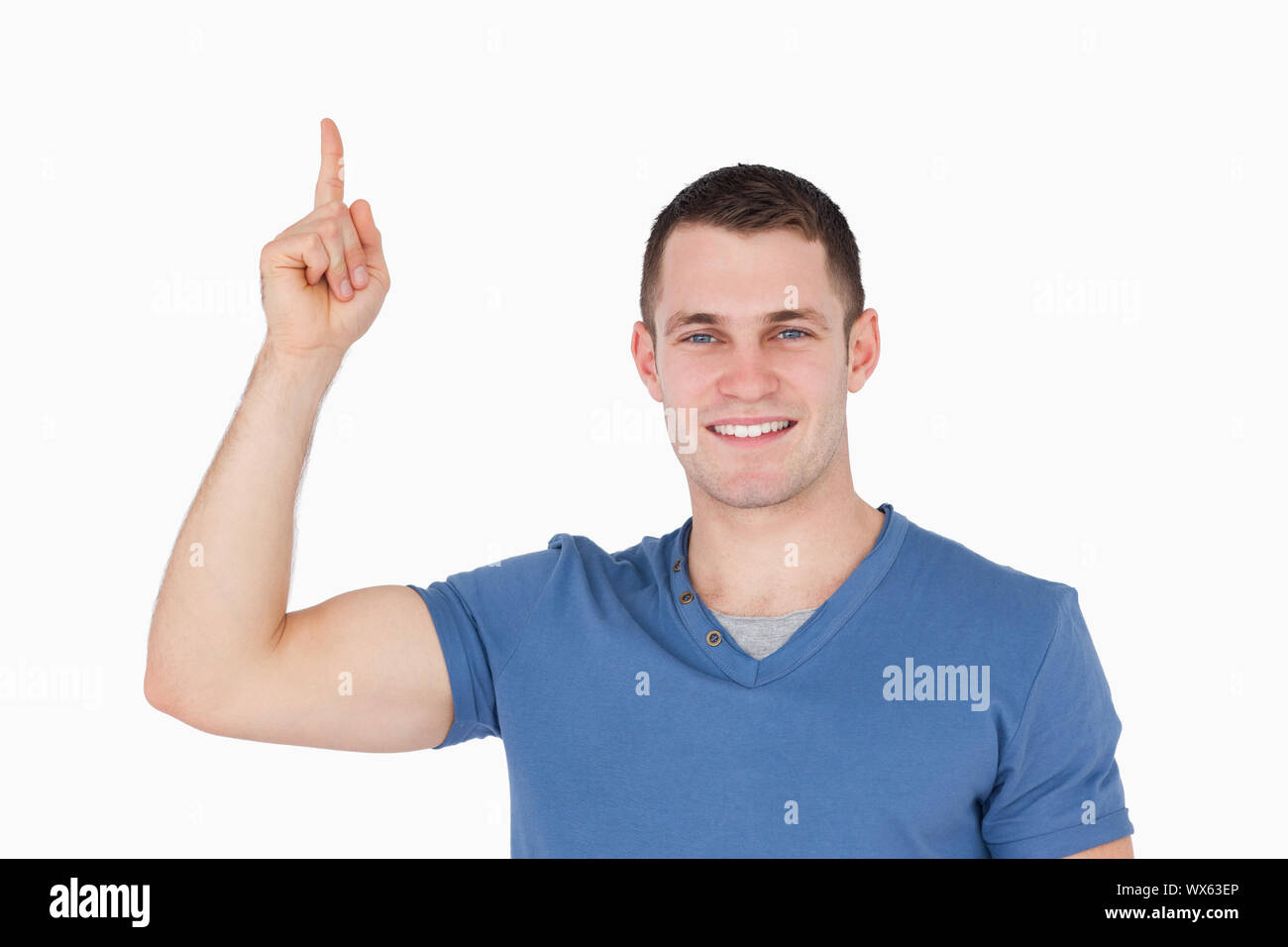 Man pointing at something against a white background Stock Photo - Alamy