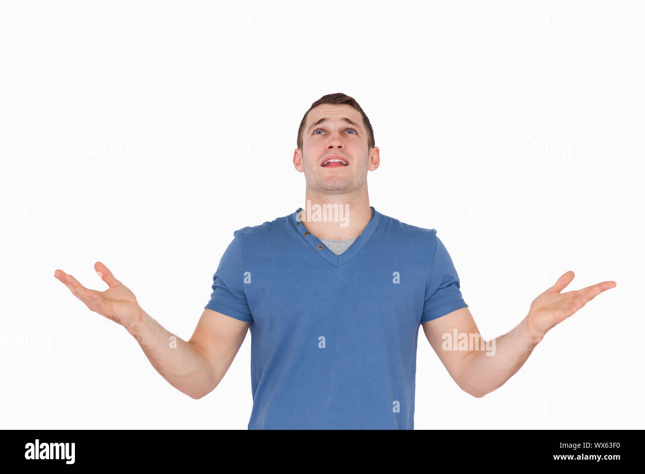 Man wondering why against a white background Stock Photo - Alamy