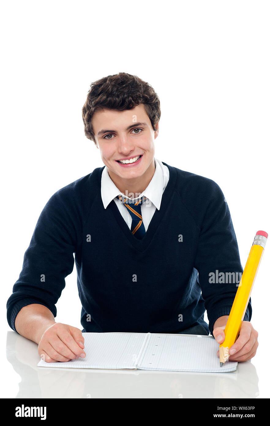 Confident student writing down notes. Isolated against white background ...
