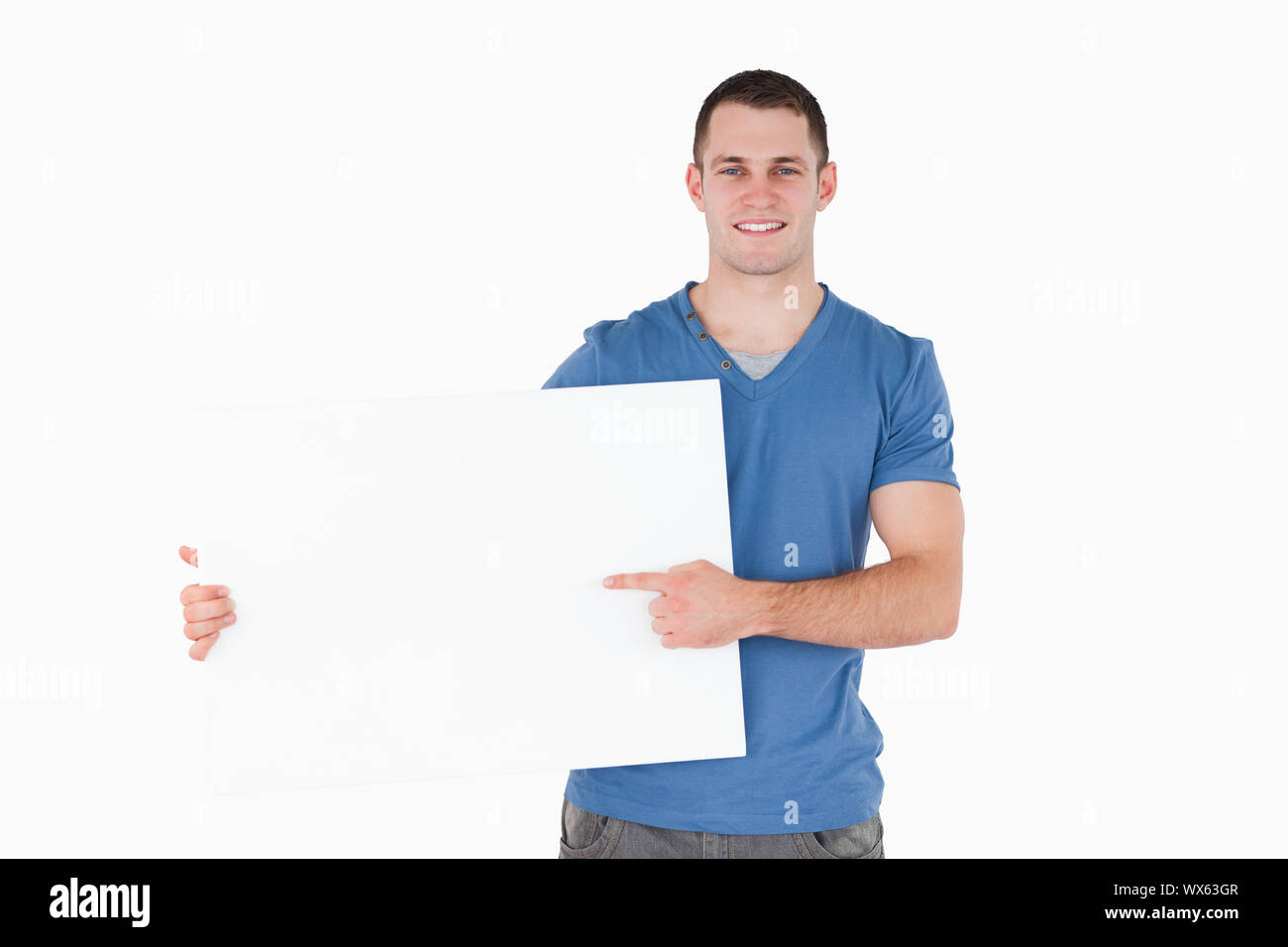 Man pointing at a blank panel against a white background Stock Photo ...
