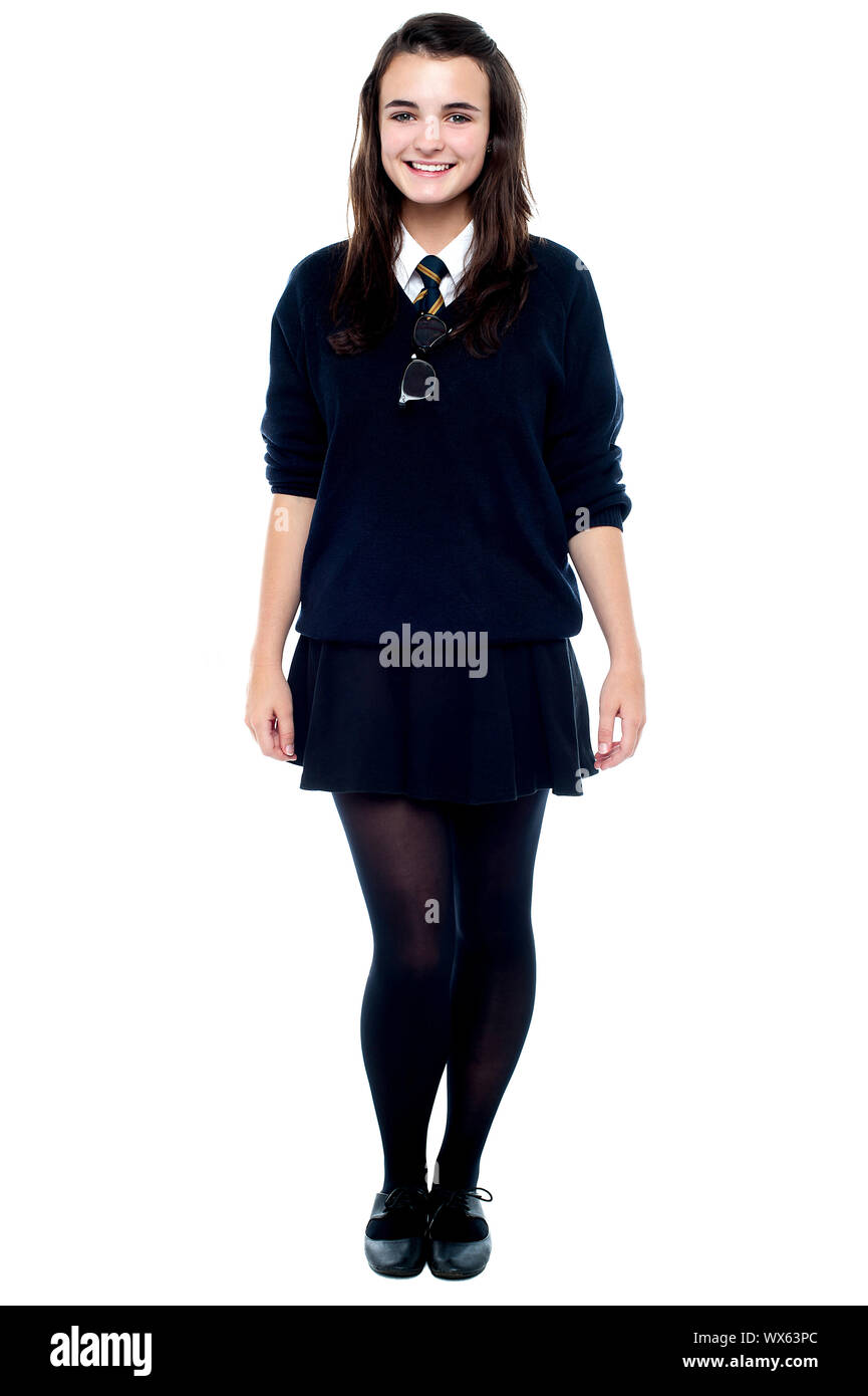 Full length portrait of pretty girl in school uniform isolated against ...