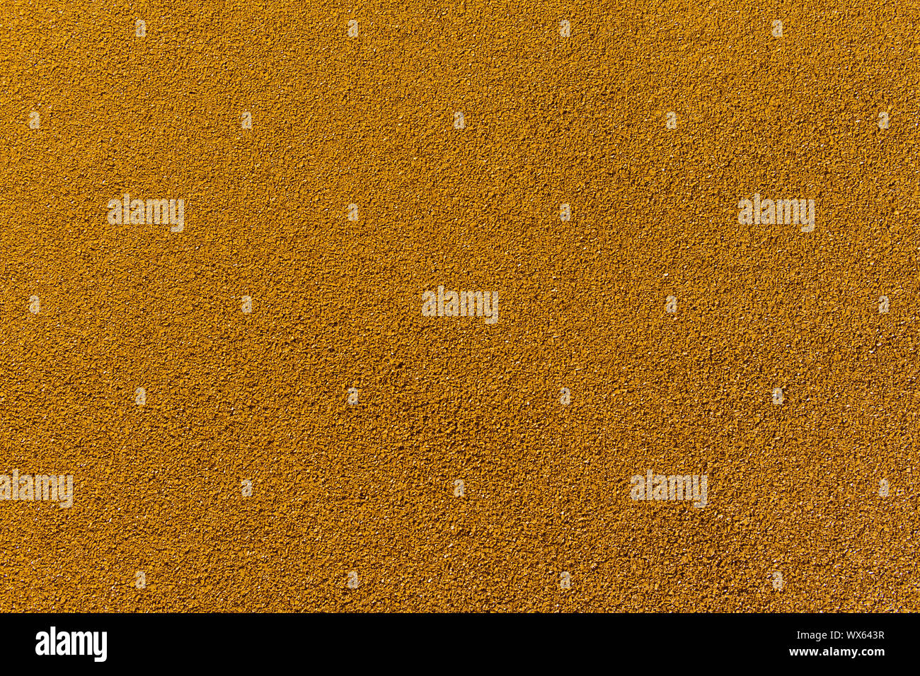 Painted rubber crumb surface. Rough colorful background. Yellow ...
