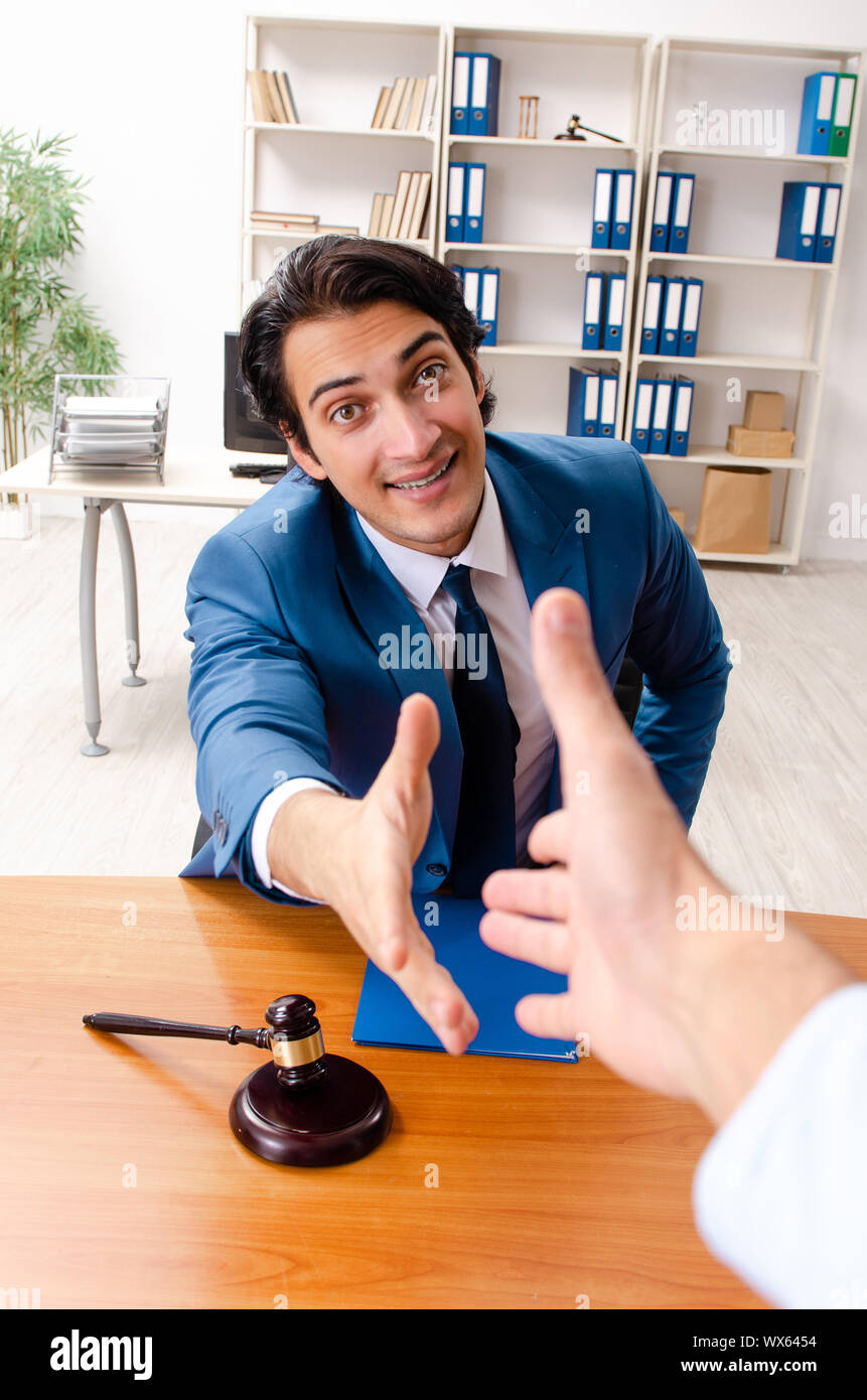 Young handsome judge sitting in courtroom Stock Photo - Alamy