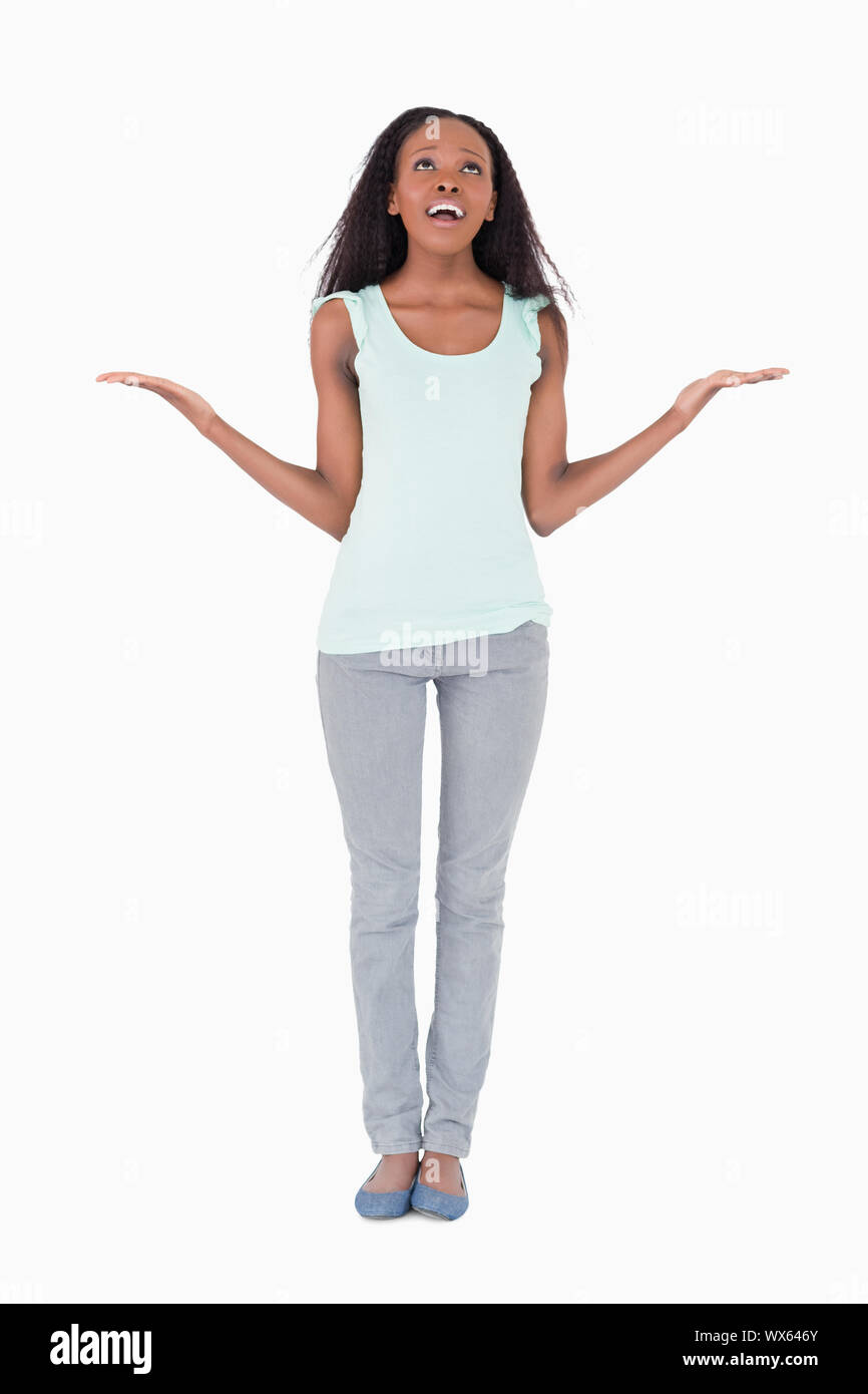 Desperate young woman asking for help from above on white background ...