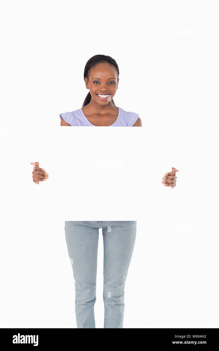 Happy smiling woman presenting placeholder on white background Stock ...