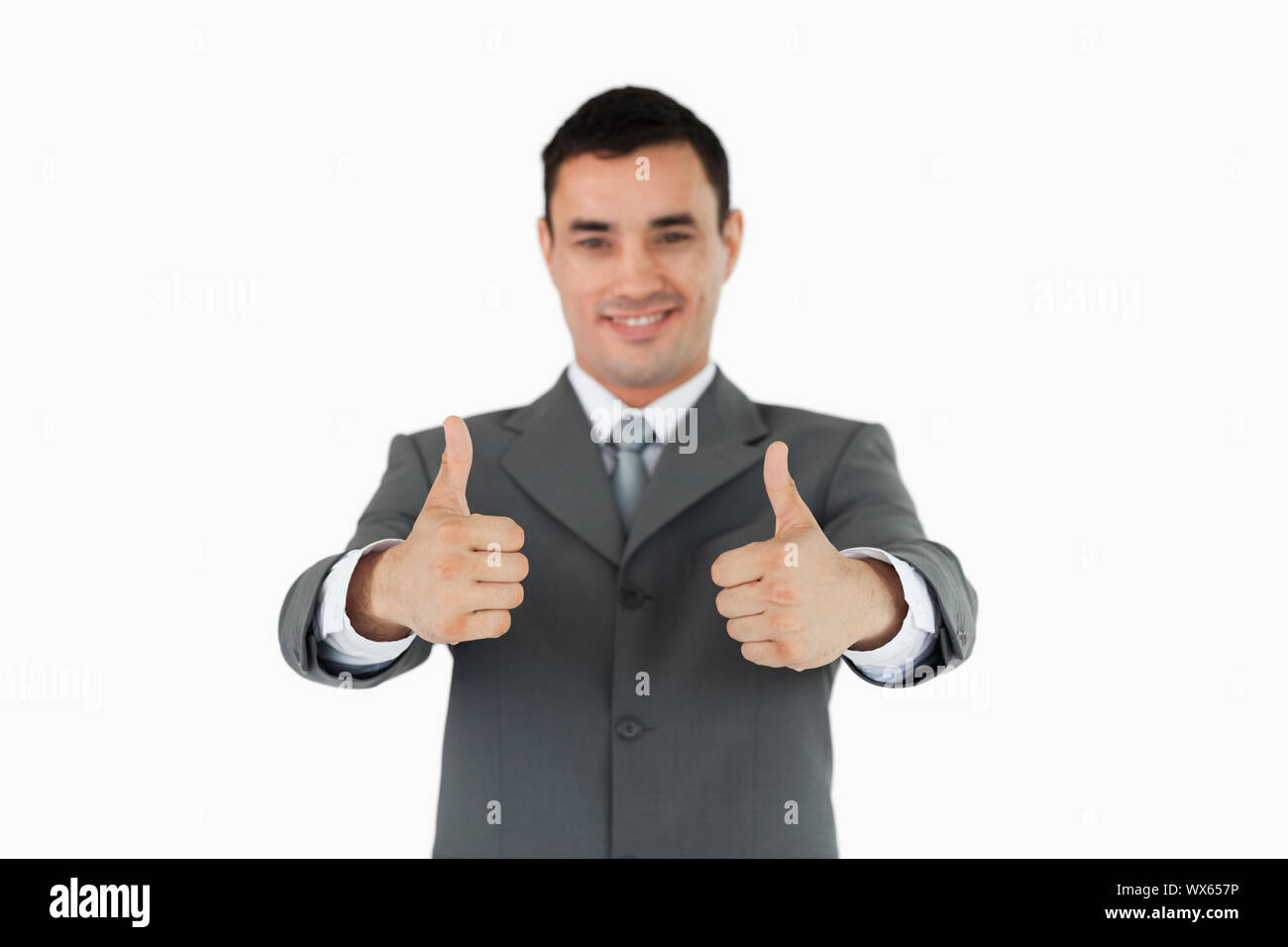 Businessman giving his approval against a white background Stock Photo ...