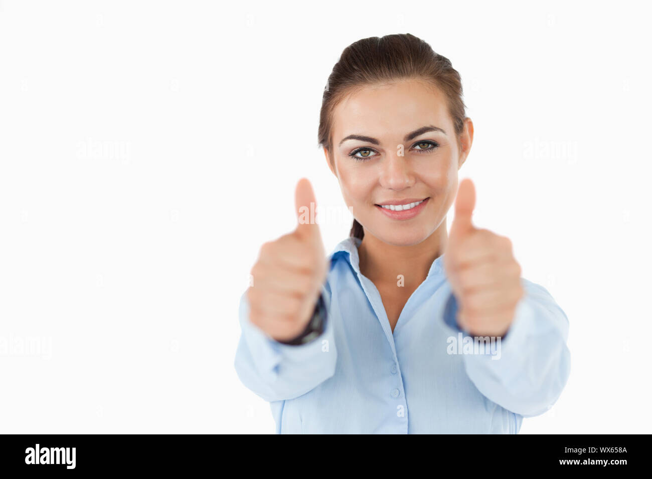 Smiling businesswoman approving against a white background Stock Photo ...
