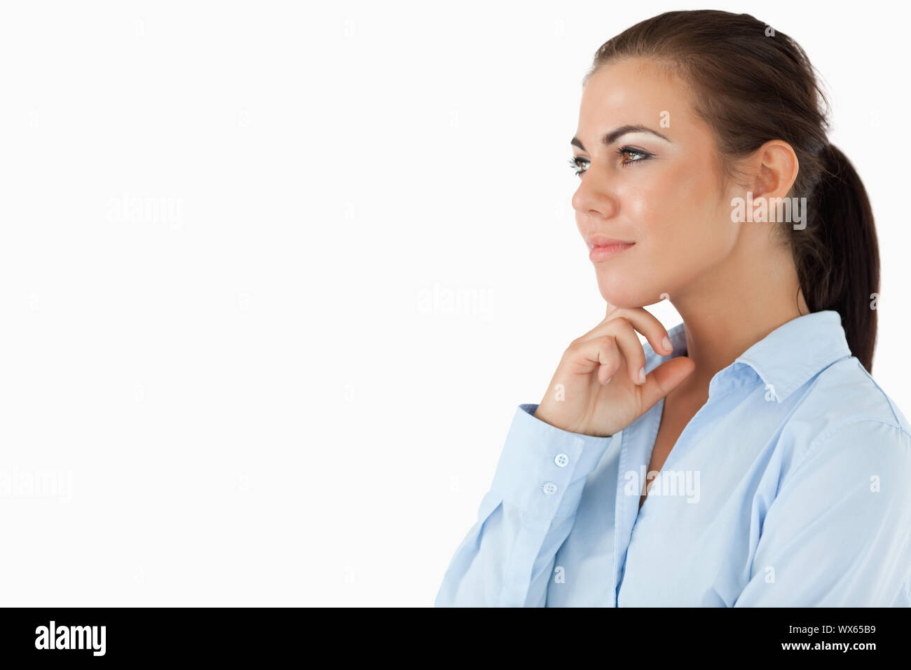 Side view of thinking businesswoman against a white background Stock ...