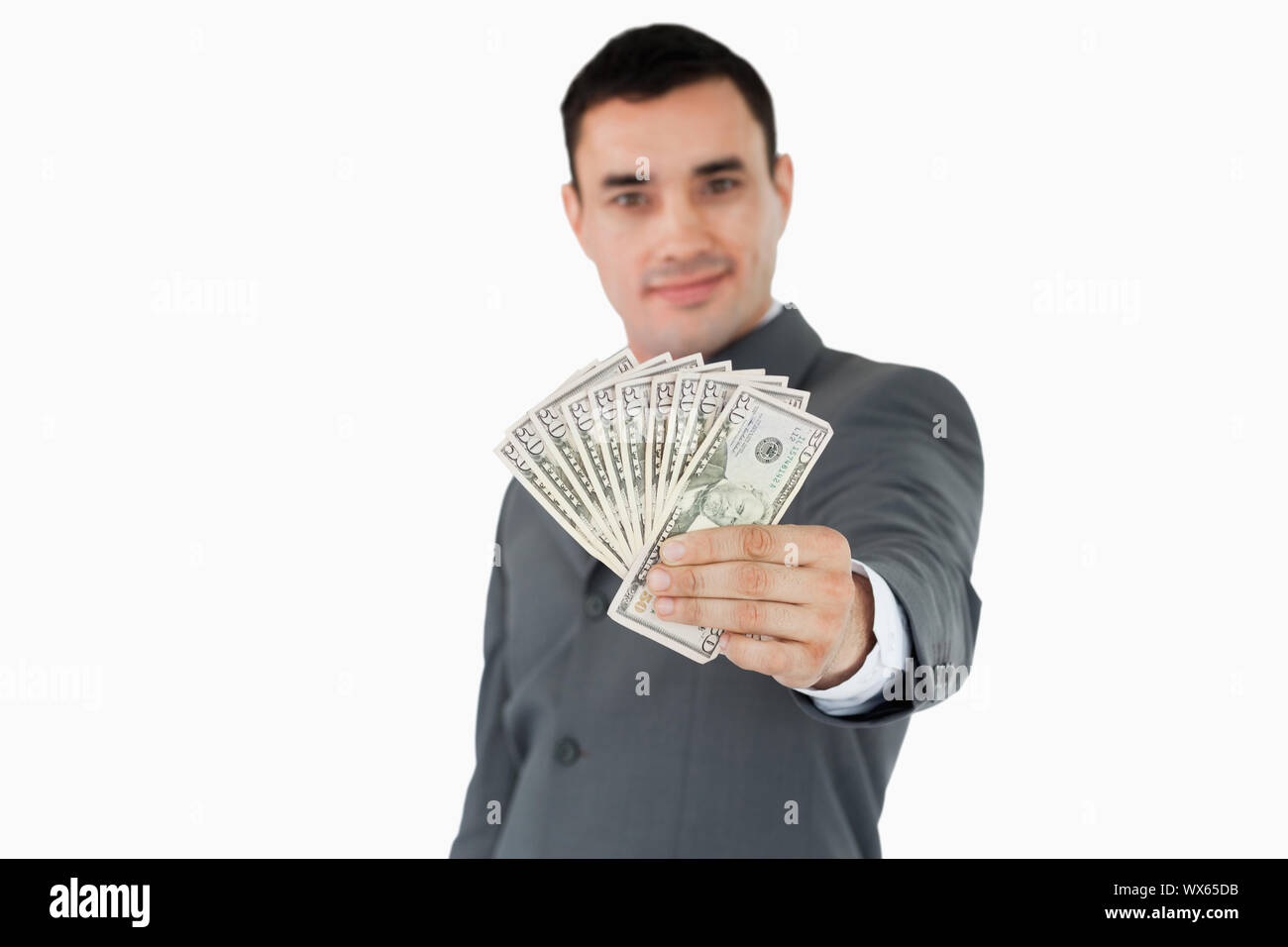 Businessman presenting bank notes against a white background Stock ...