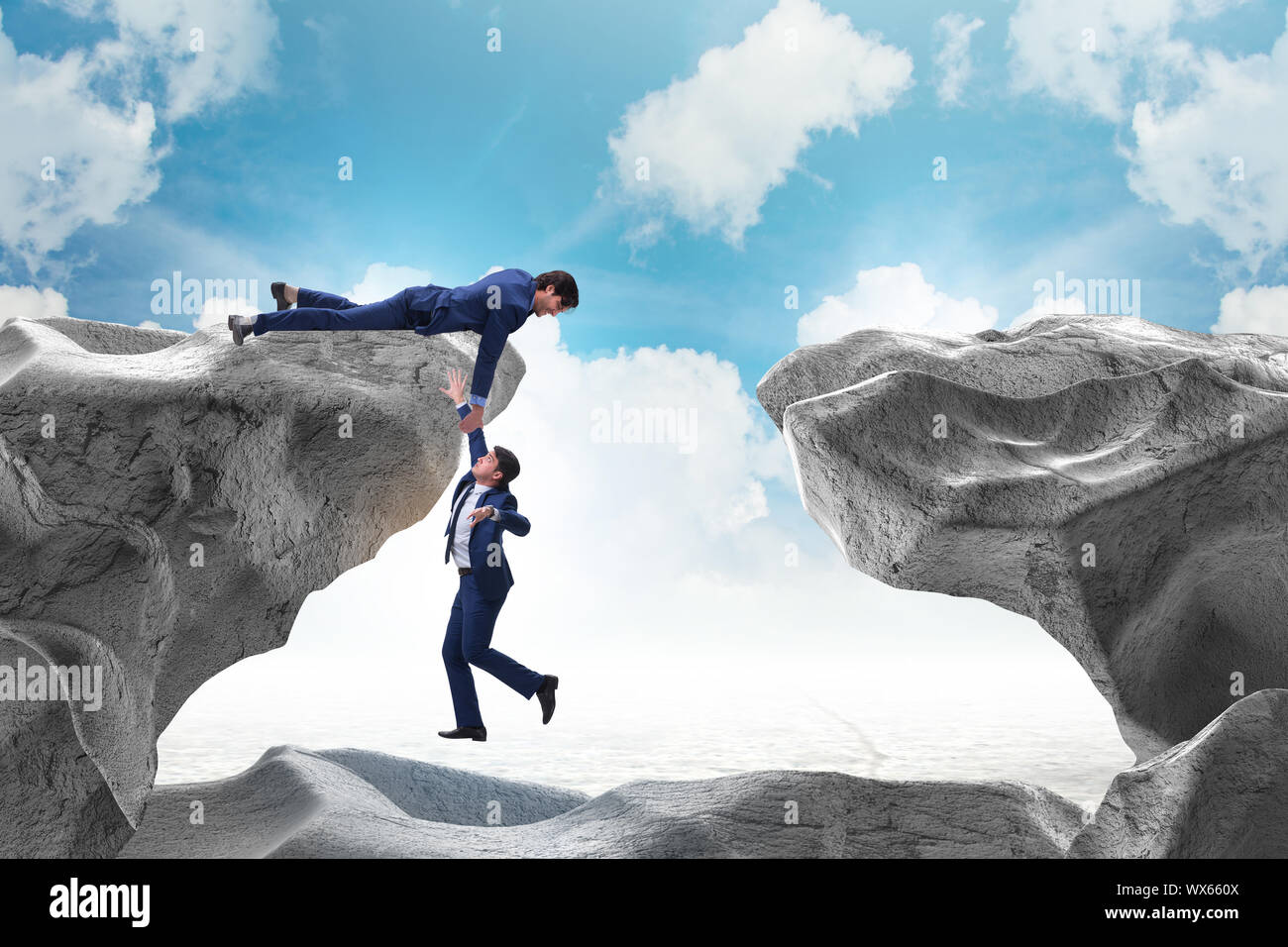 Businessman pulling falling hi-res stock photography and images - Alamy