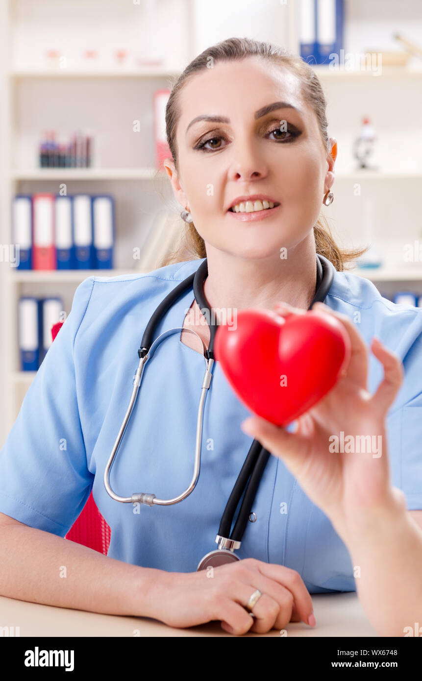 Female doctor cardiologist working in the clinic Stock Photo - Alamy