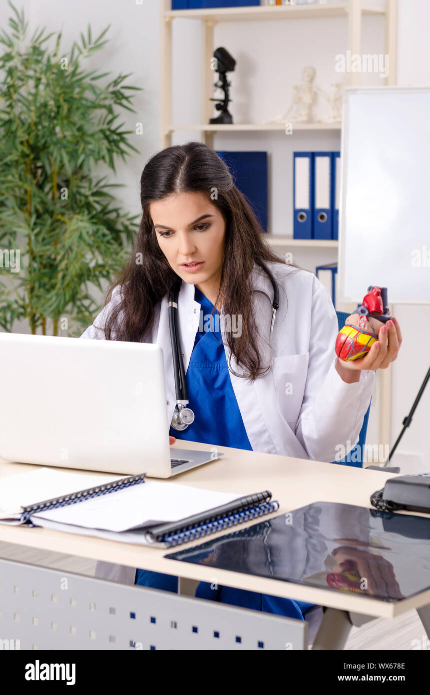 Female doctor cardiologist working in the clinic Stock Photo - Alamy