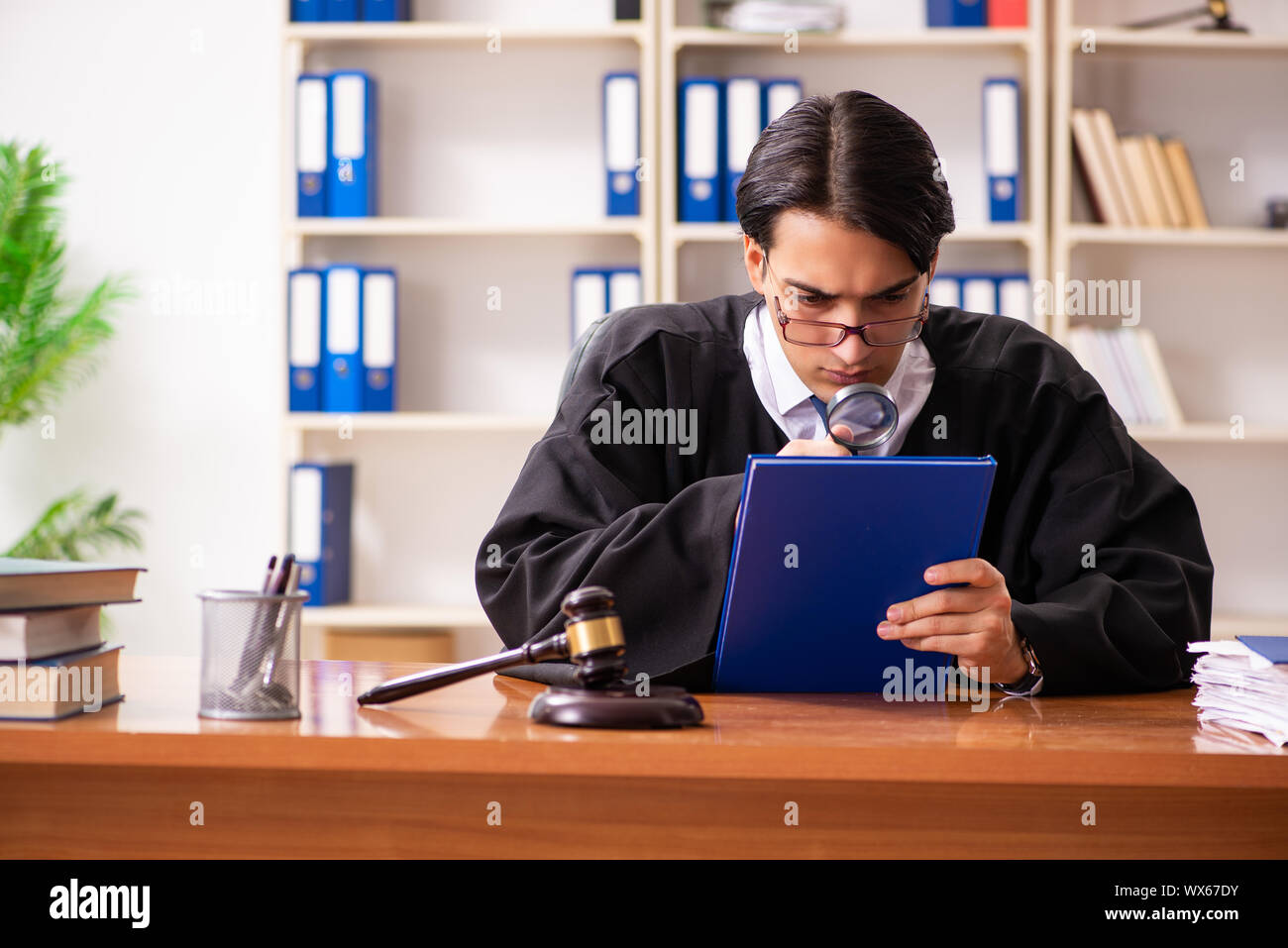 Young handsome judge working in court Stock Photo - Alamy