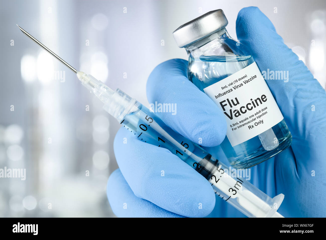 Small drug vial with influenza vaccine Stock Photo - Alamy