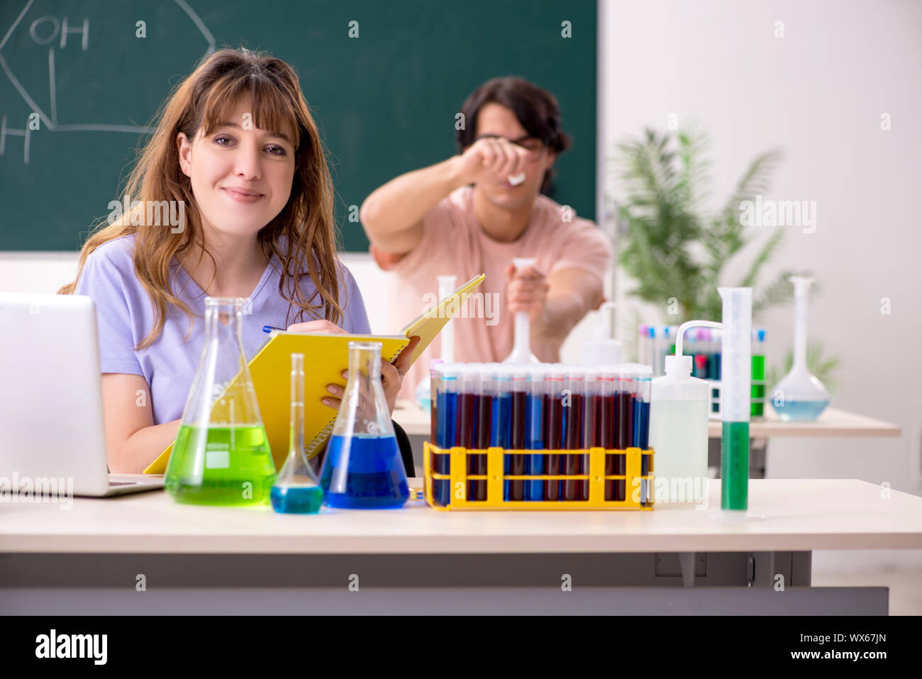 Two chemists students in classroom Stock Photo - Alamy