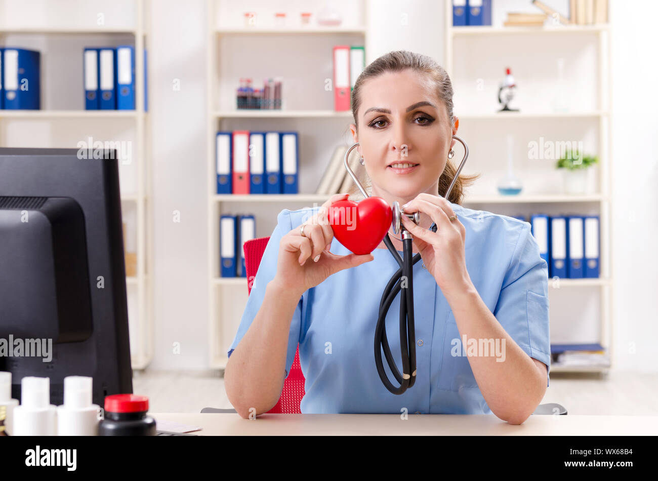 Female doctor cardiologist working in the clinic Stock Photo - Alamy