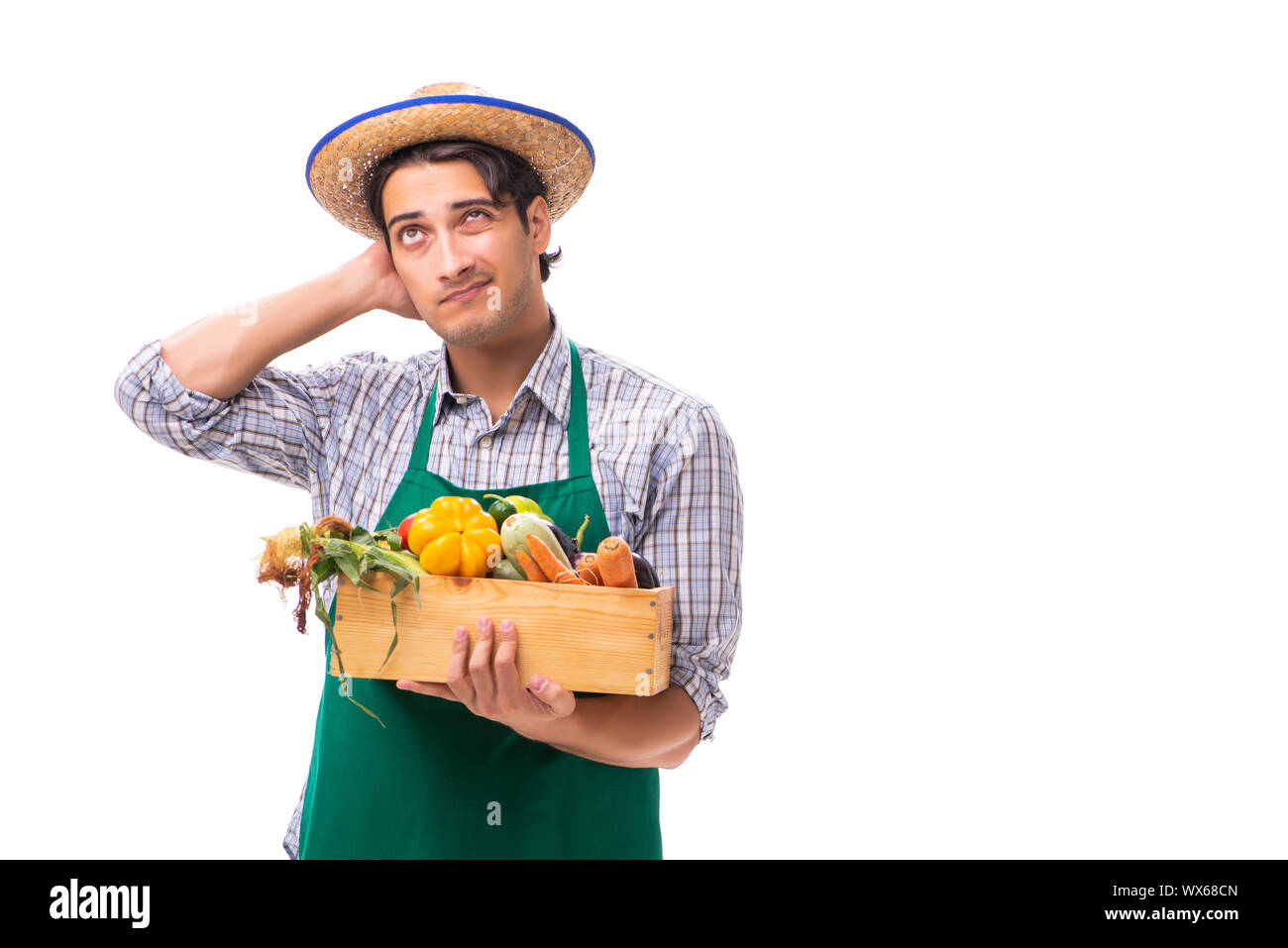 Young farmer with fresh produce isolated on white background Stock ...