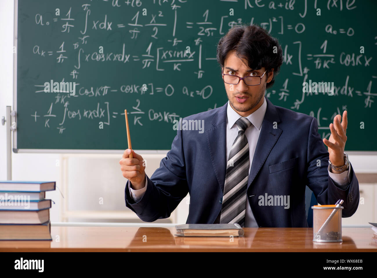 Teacher pointing to math equation hi-res stock photography and images ...