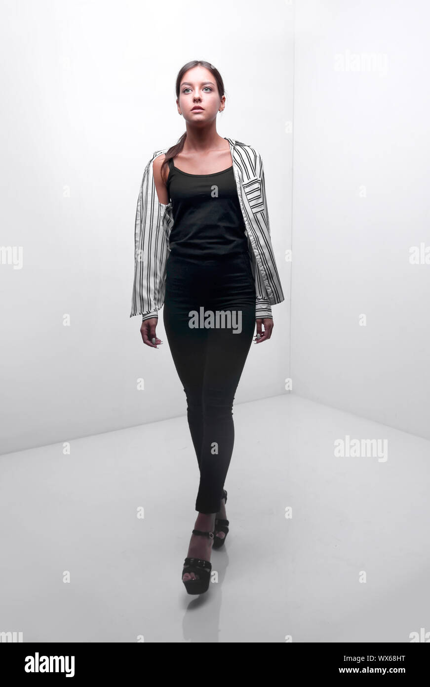 sad young woman walking forward Stock Photo - Alamy