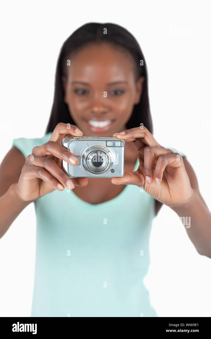 Digi cam being used by smiling woman against a white background Stock ...
