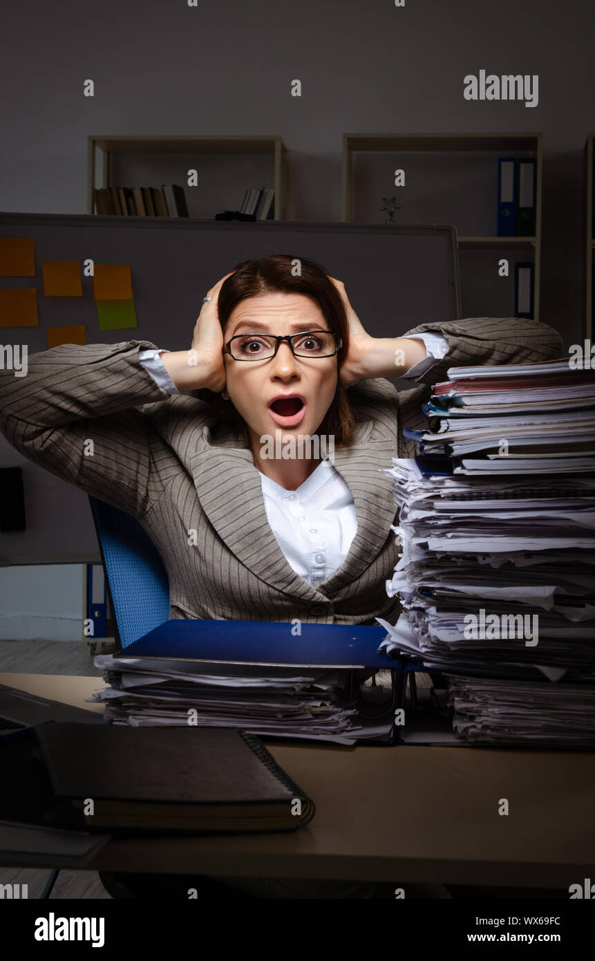 Female employee suffering from excessive work Stock Photo - Alamy