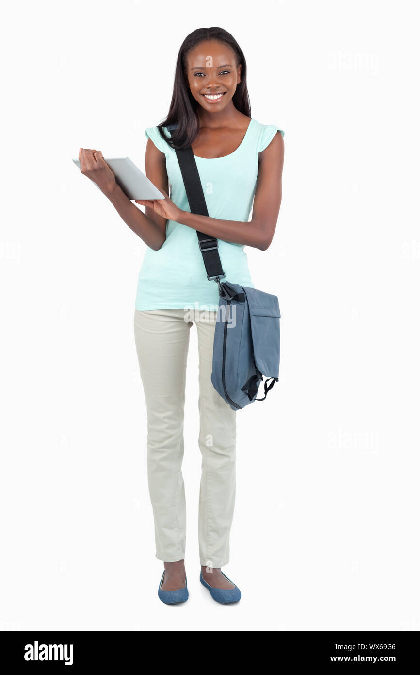 Smiling young student with her scratchpad against a white background ...