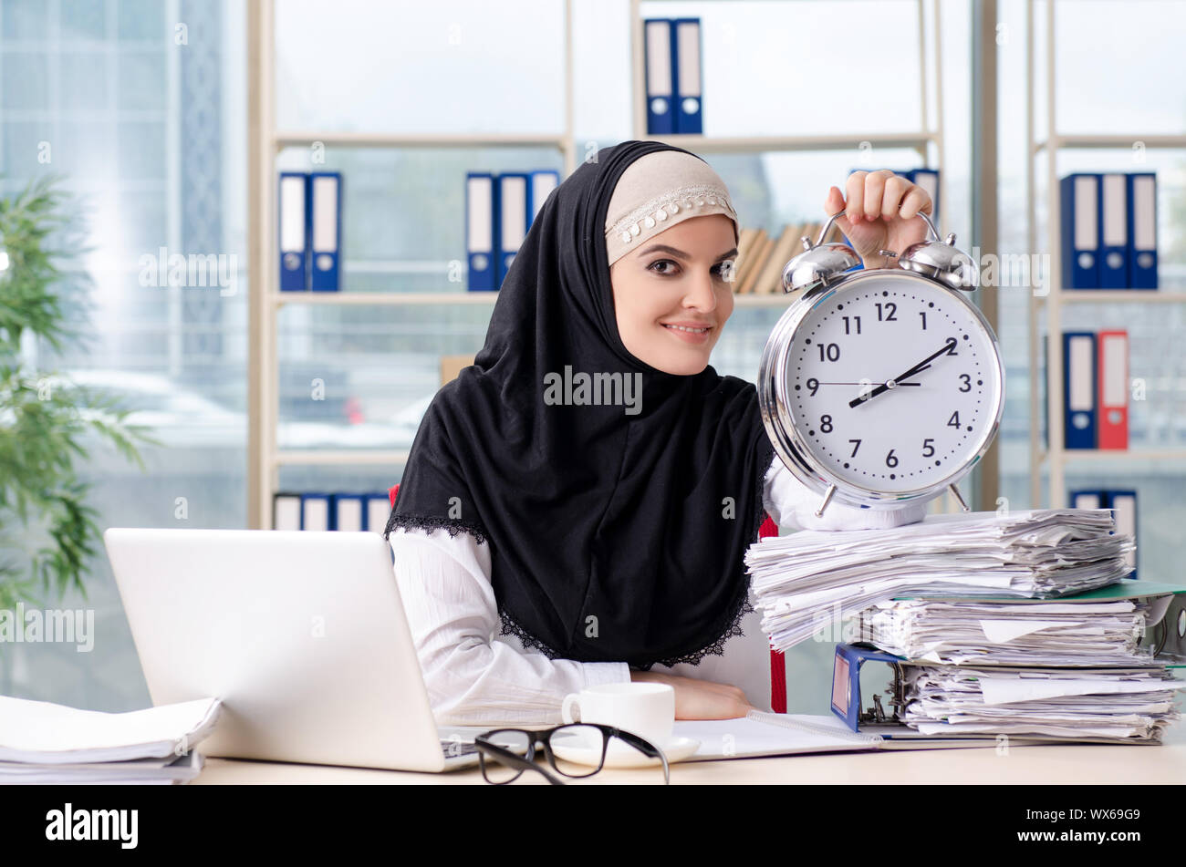 Saudi businesswoman working documents hi-res stock photography and ...