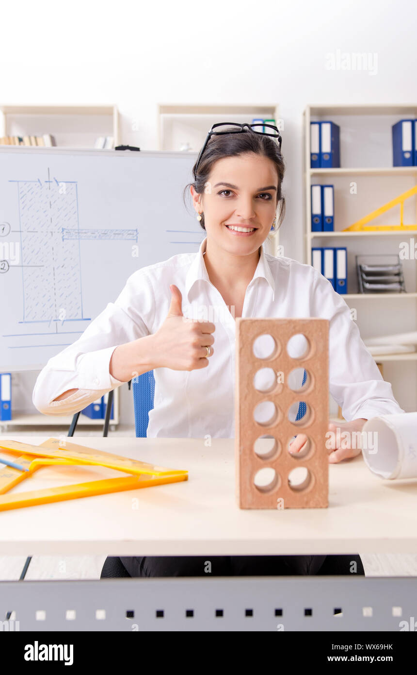 Female architect working in the office Stock Photo - Alamy