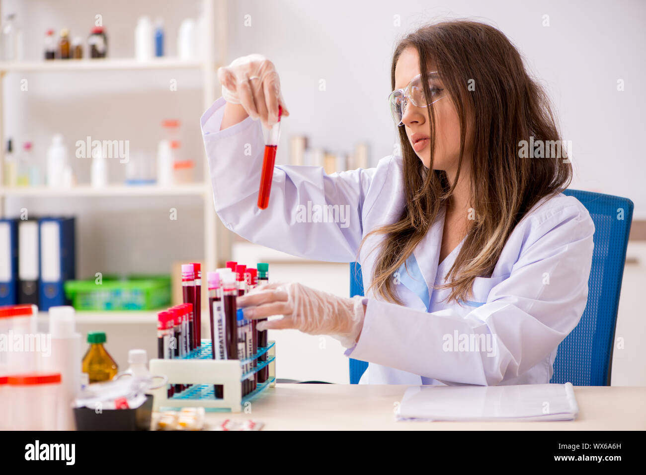 Young biochemist testing blood hi-res stock photography and images - Alamy