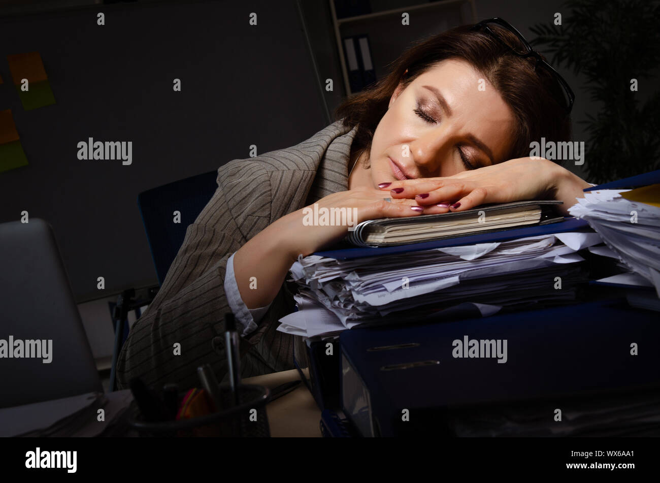 Female employee suffering from excessive work Stock Photo - Alamy