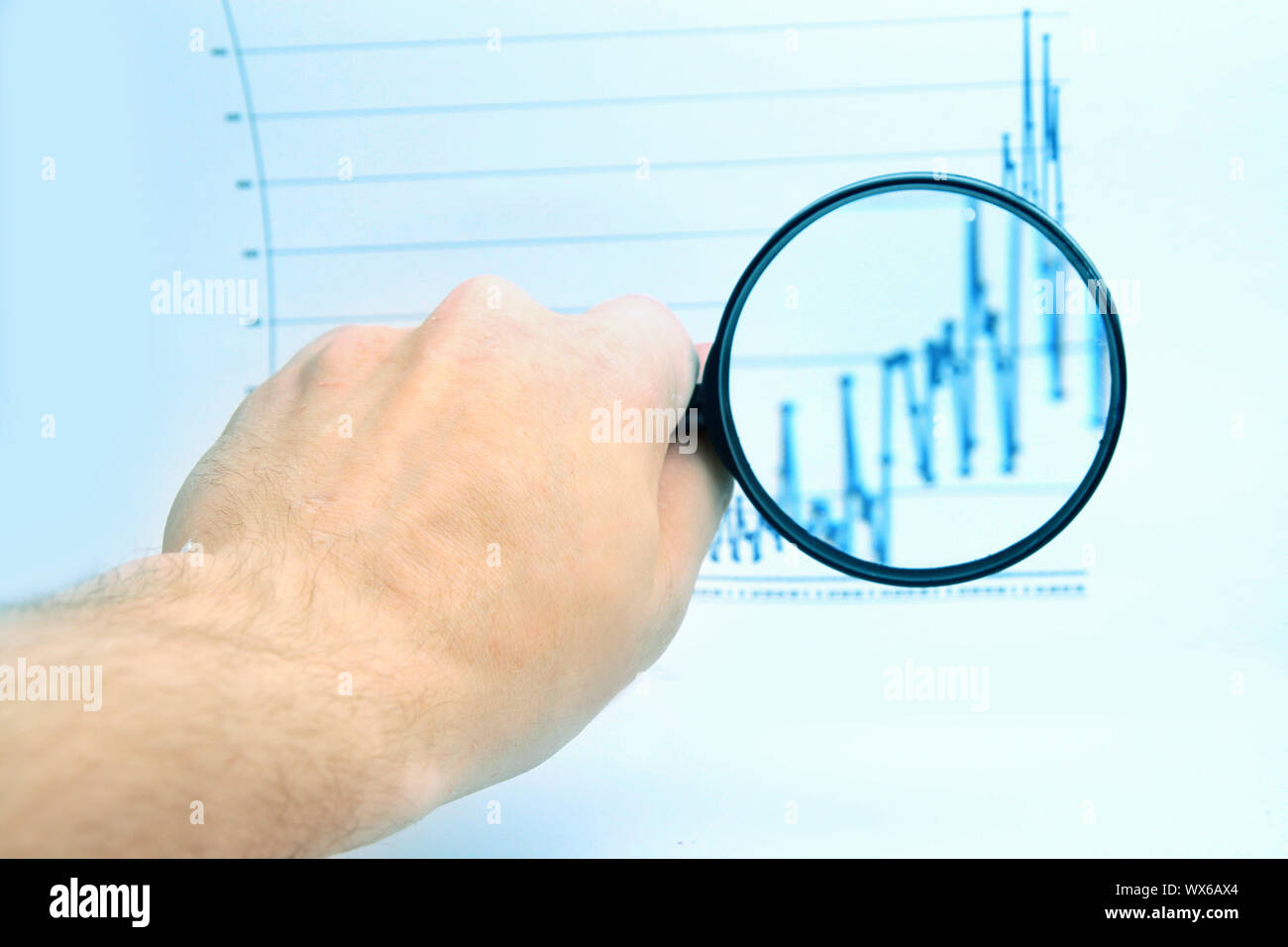 magnifier in men hand isolated Stock Photo - Alamy