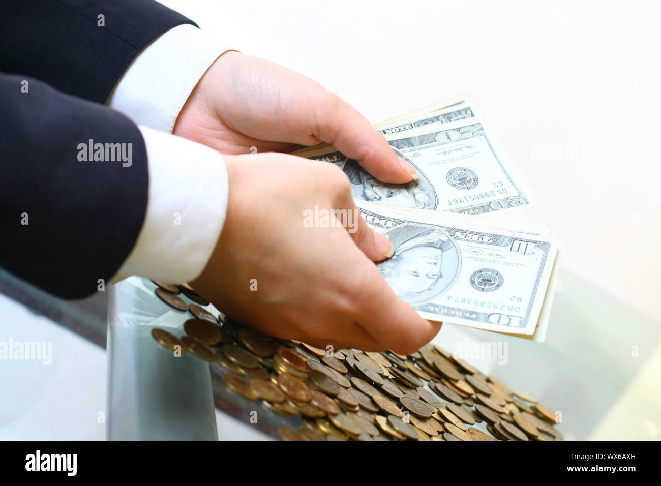 hands counting dollar money on white background Stock Photo - Alamy