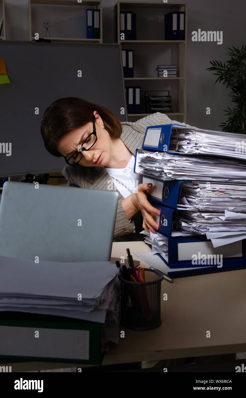 Female employee suffering from excessive work Stock Photo - Alamy