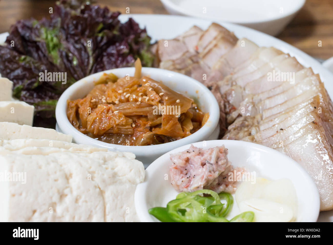Korean traditional food bossam, boiled pork eaten with a salty sauce ...