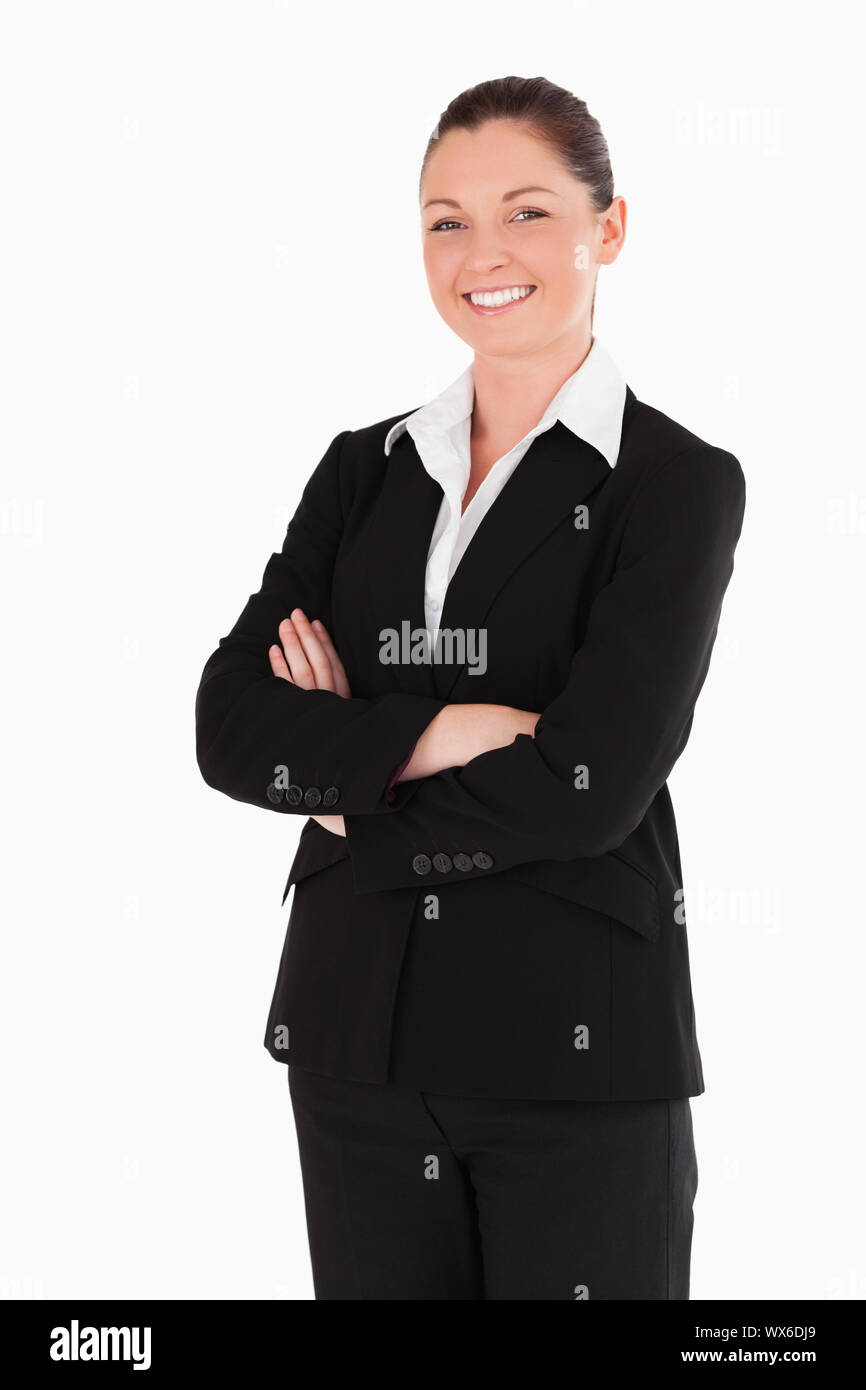 Beautiful woman in suit posing while standing against a white ...